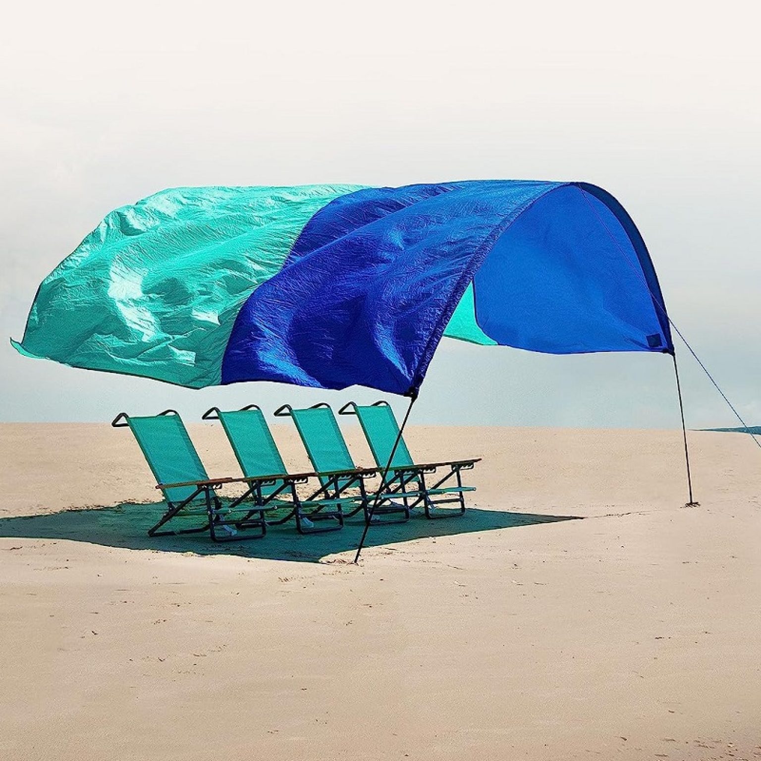 The Shibumi Shade is a Wind Powered Beach Canopy That Uses The Wind to ...